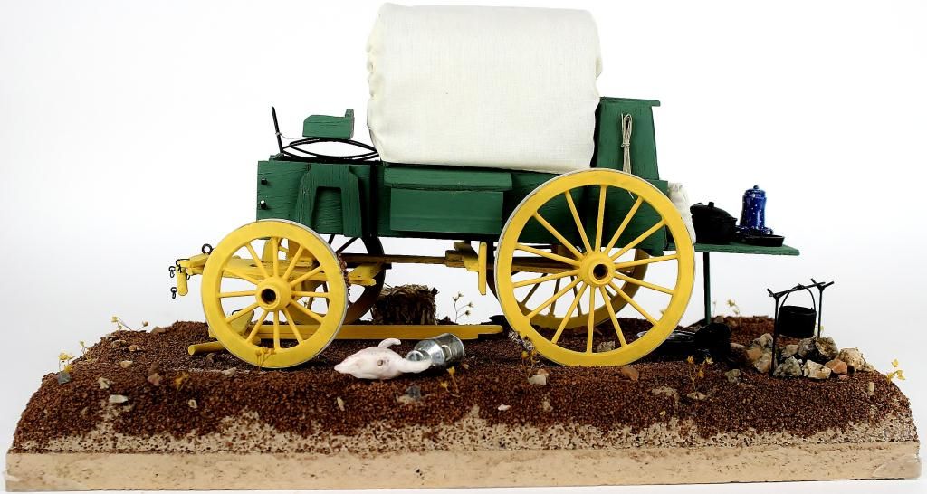 Miniature wooden scale model of cowboy chuck wagon