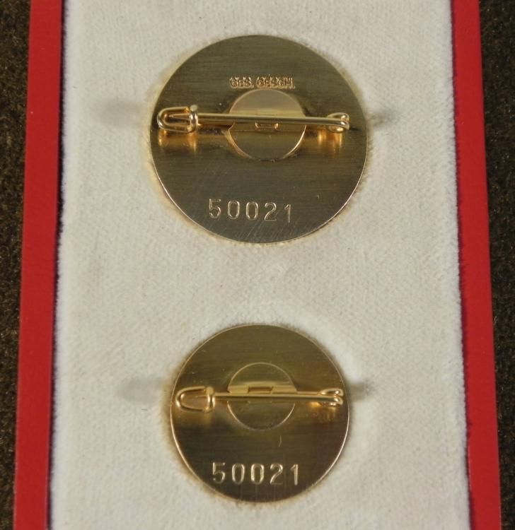 CASED SET GOLDEN NAZI PARTY PINS-NUMBERED IN RED FITTED