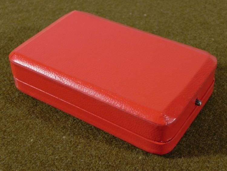 CASED SET GOLDEN NAZI PARTY PINS-NUMBERED IN RED FITTED