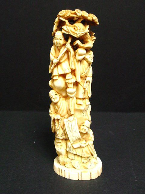 Chinese carved bone statue signed