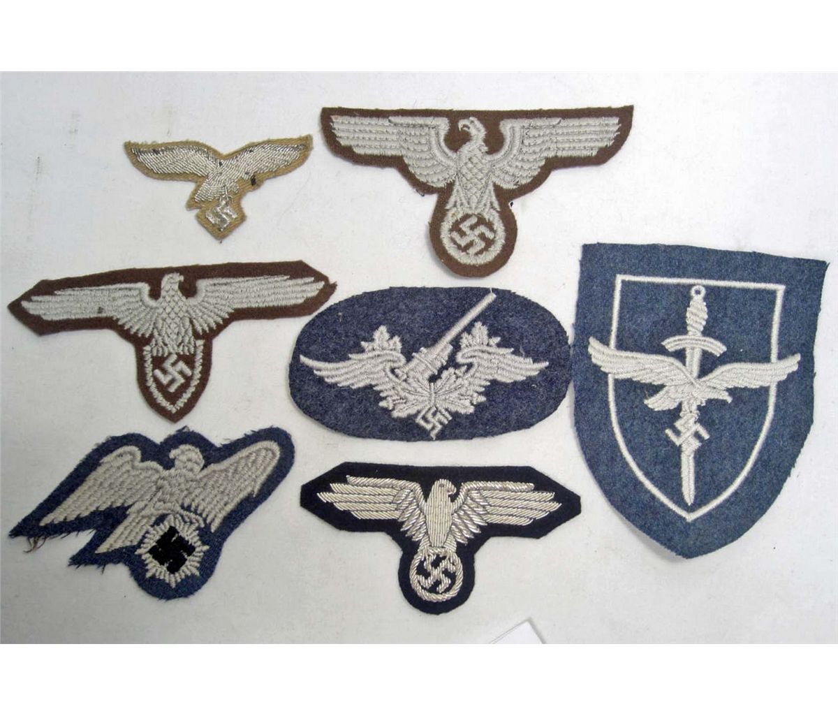LOT OF 7 GERMAN NAZI ARM EAGLE AND INSIGNIAS