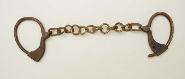 Pair of large old Tower style leg irons that have seen lots of use and ...