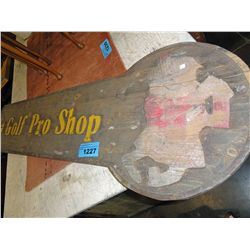 Wooden golf pro shop sign