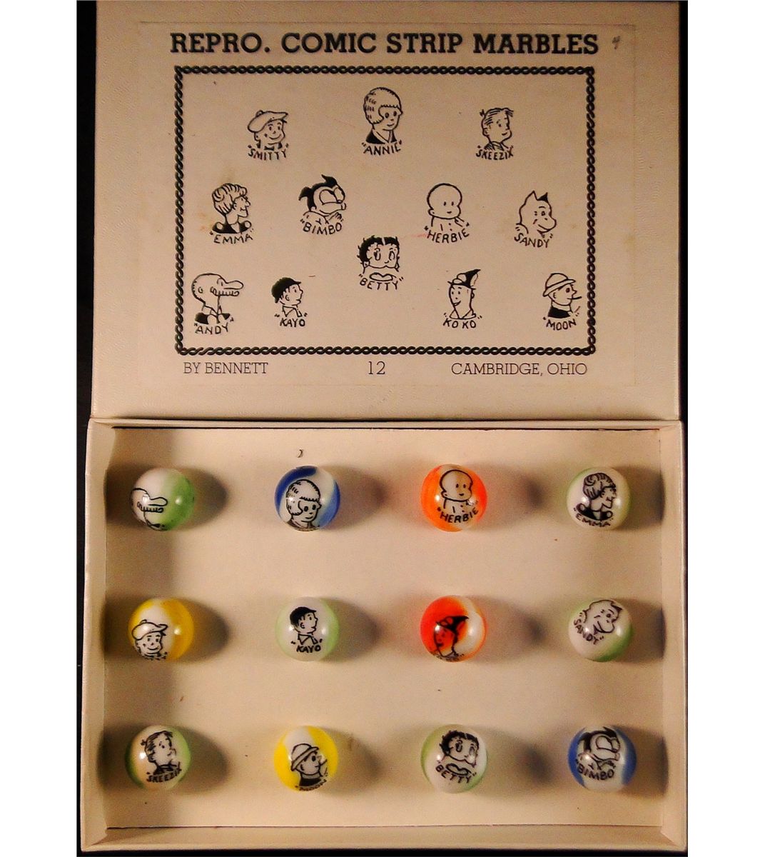 Marbles: Lot 104. Harold Bennett Boxed Set of 12 Comic Marbles.