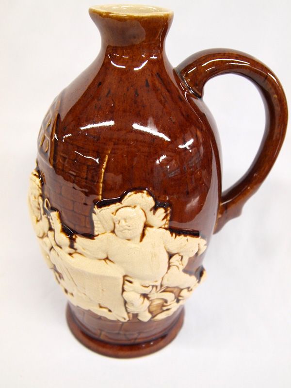 German Antique Raised Relief Pitcher