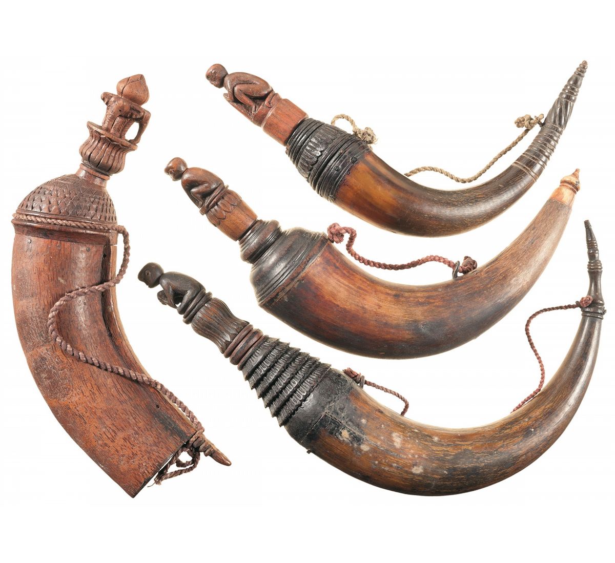 Four Unique Powder Horns with Carved Figural Plugs