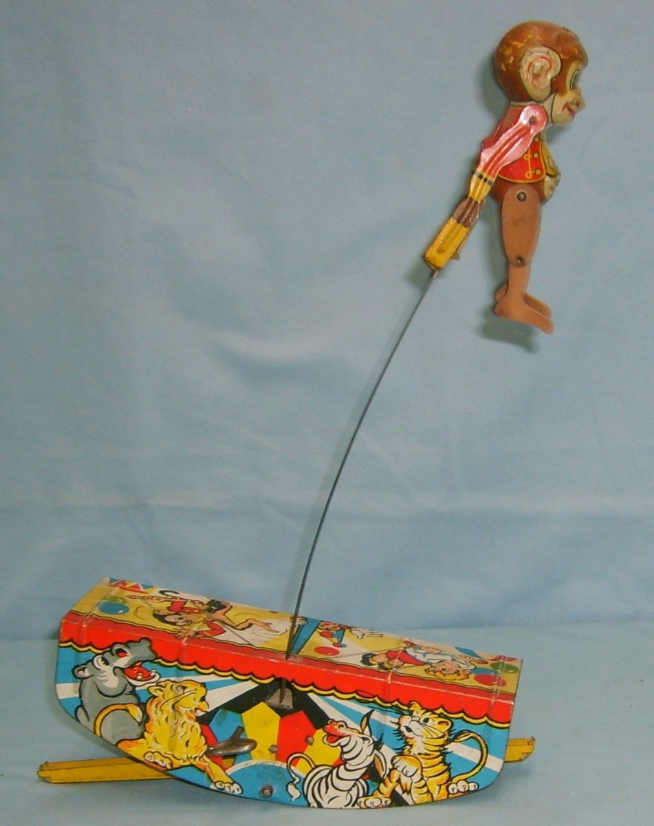 MARX Acrobatic marvel swinging monkey toy, works well, 8”W x 13”H
