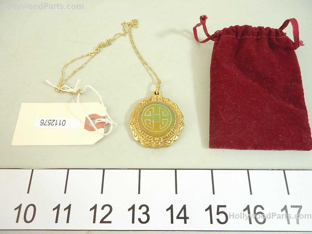 ORIGINAL SIN GOLD LOCKET WITH PLASTIC MEDALLION ON FINE CHAIN