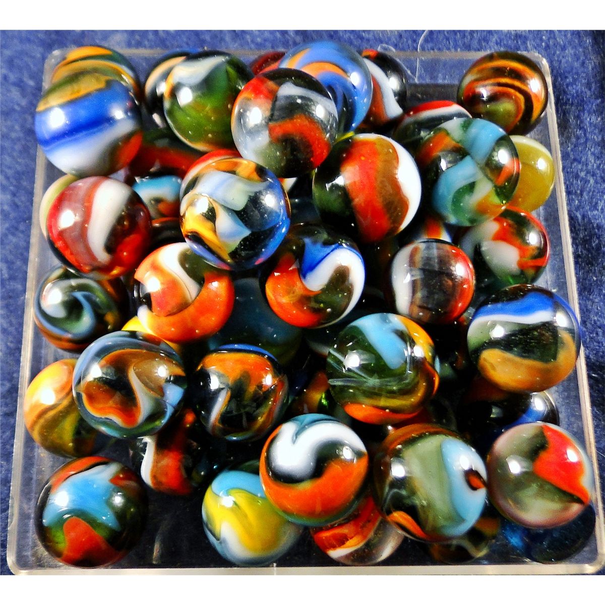 Marbles: Lot #65. 50 Peltier Rainbos and Tri-colors.