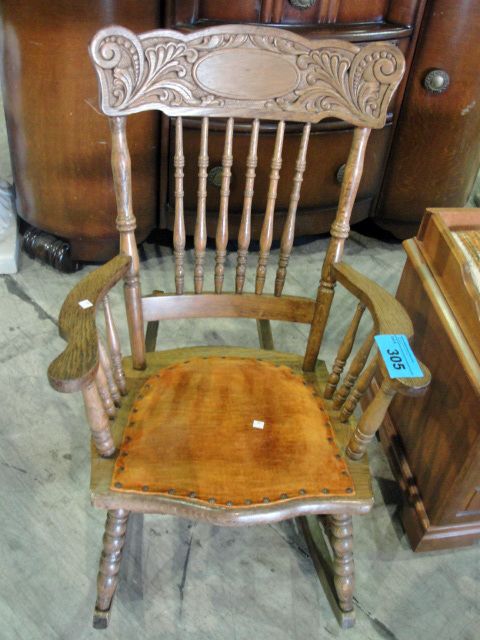 Antique oak pressed back rocking chair