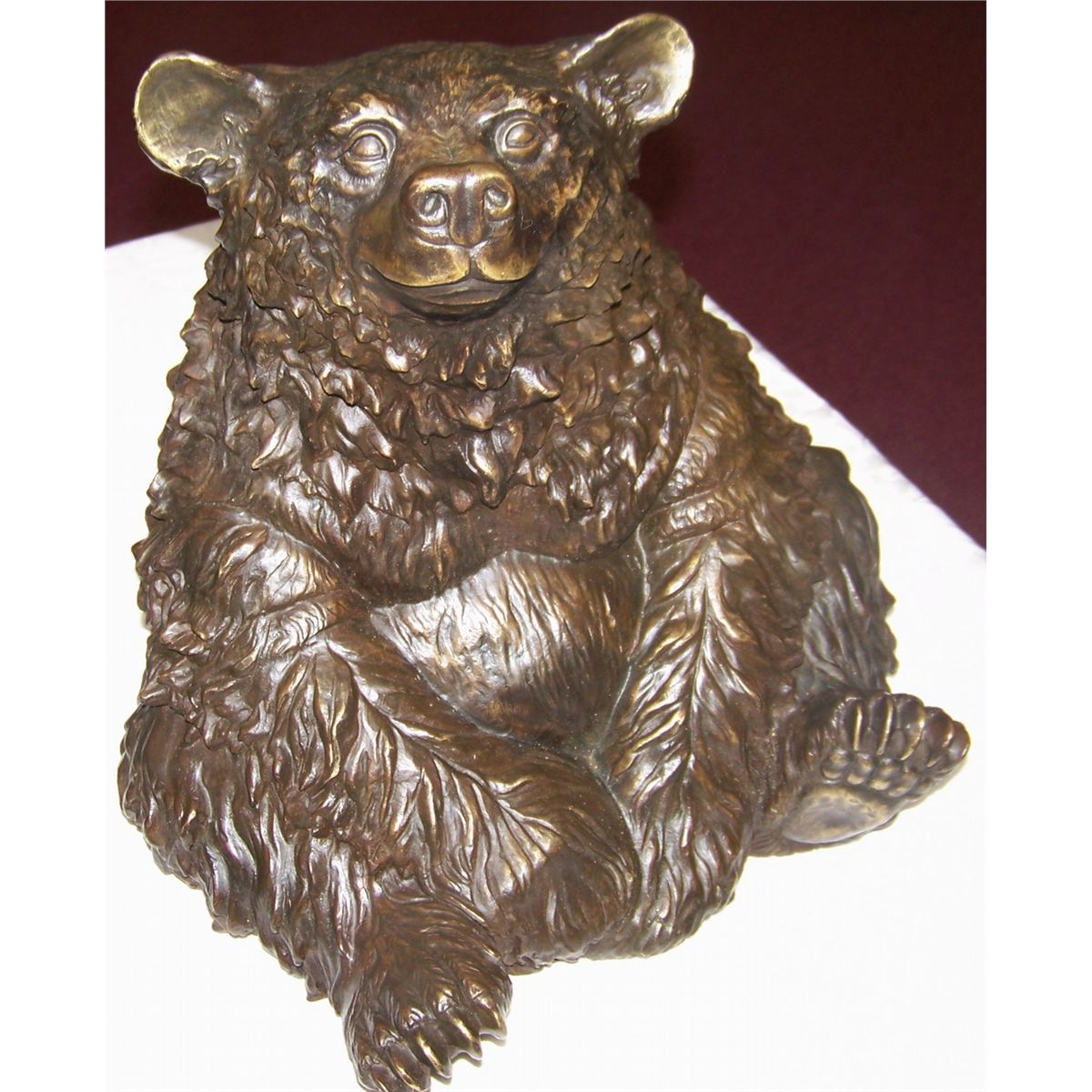 RICK ROWLEY SEATED BRONZE BEAR SCULPTURE, 16T X 17L X 18D
