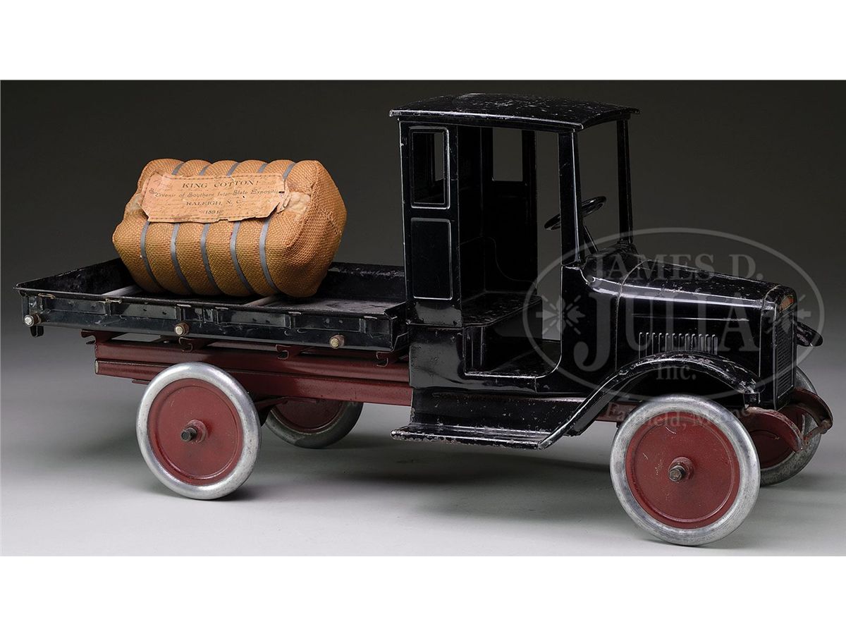 BUDDY L STAKE SIDE LUMBER TRUCK.