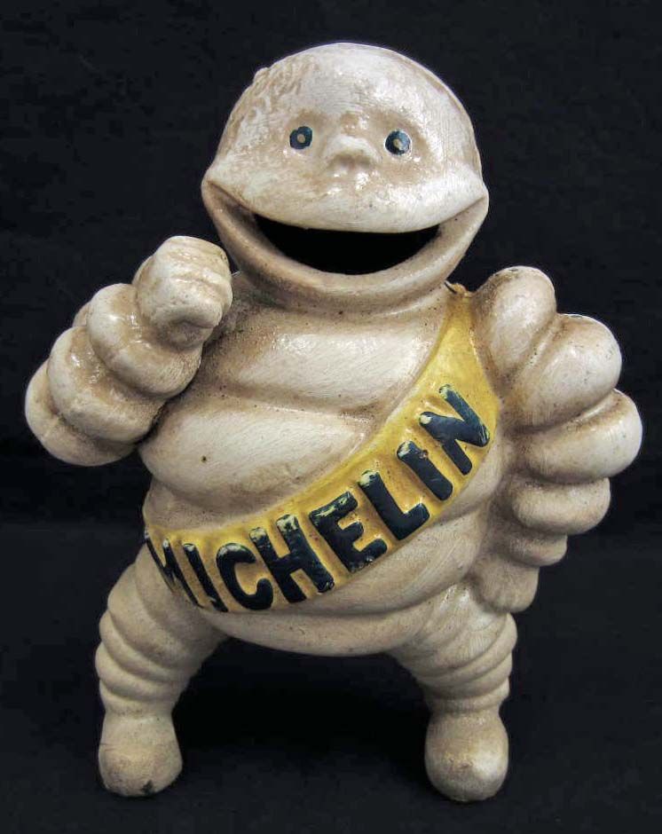 CAST IRON MICHELIN MAN ADVERTISING COIN BANK - 6" TALL