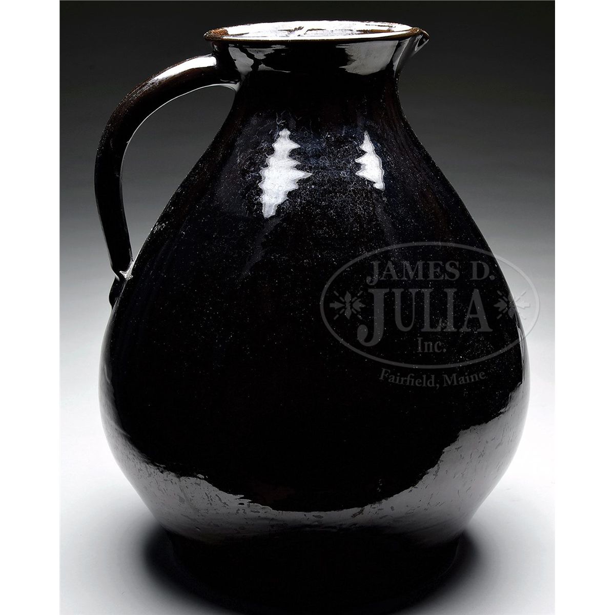 LARGE MANGANESE GLAZED REDWARE PITCHER.