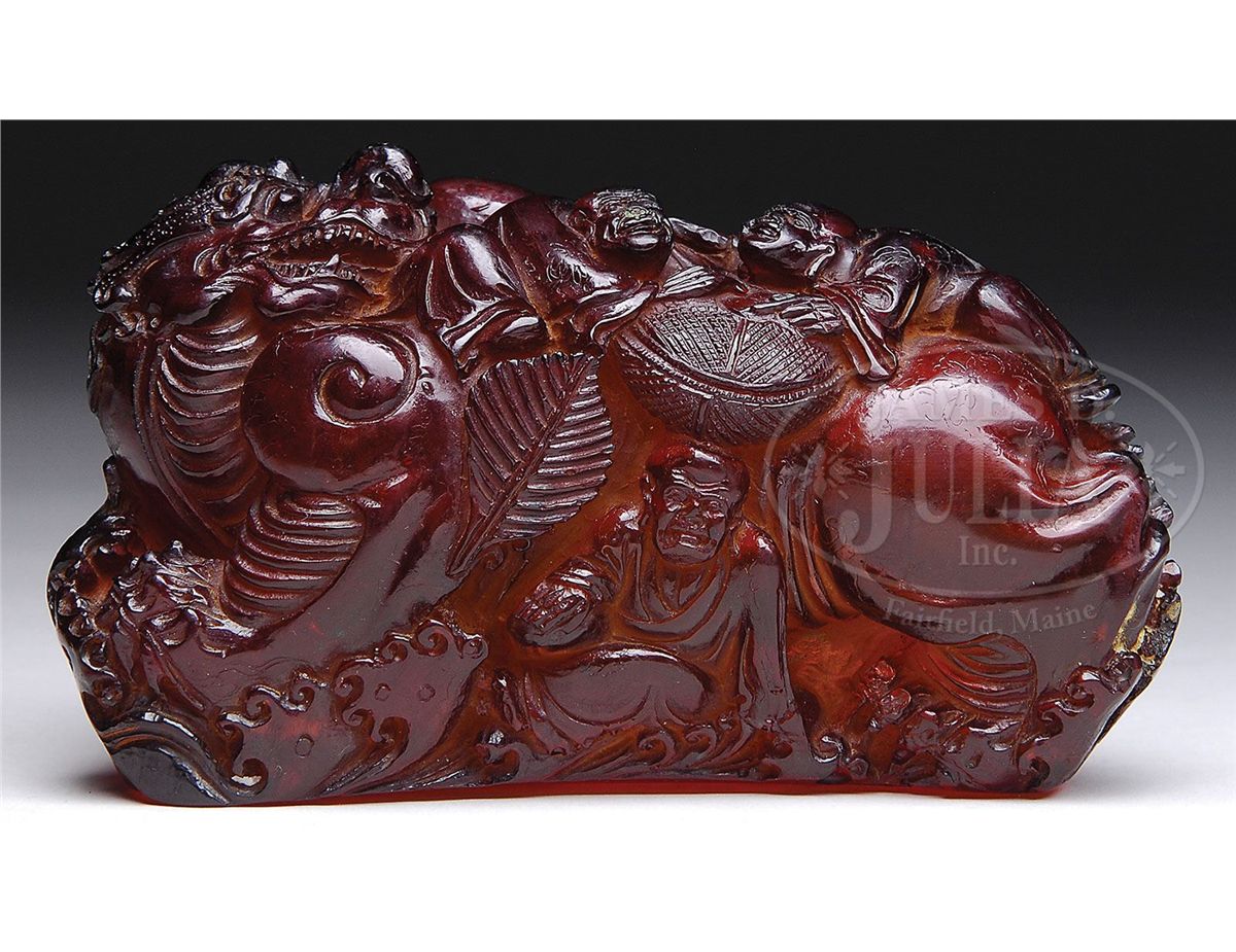EARLY RED AMBER CARVING.