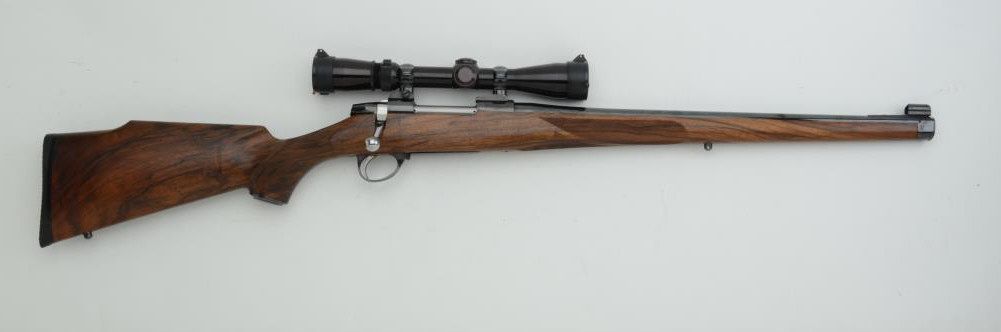 Sako bolt action rifle with custom mannlicher checkered deluxe wood ...