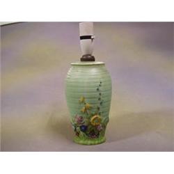 An Art Deco Crown Devon pottery table lamp with floral decoration the ...