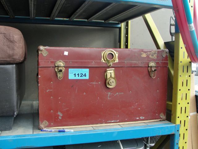 Red metal steamer trunk