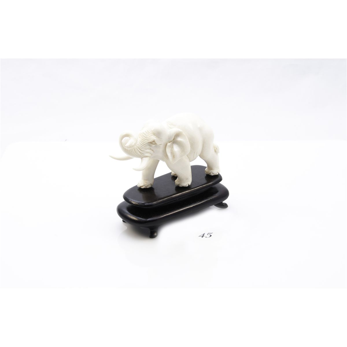 Genuine ivory carved elephant figurine on small