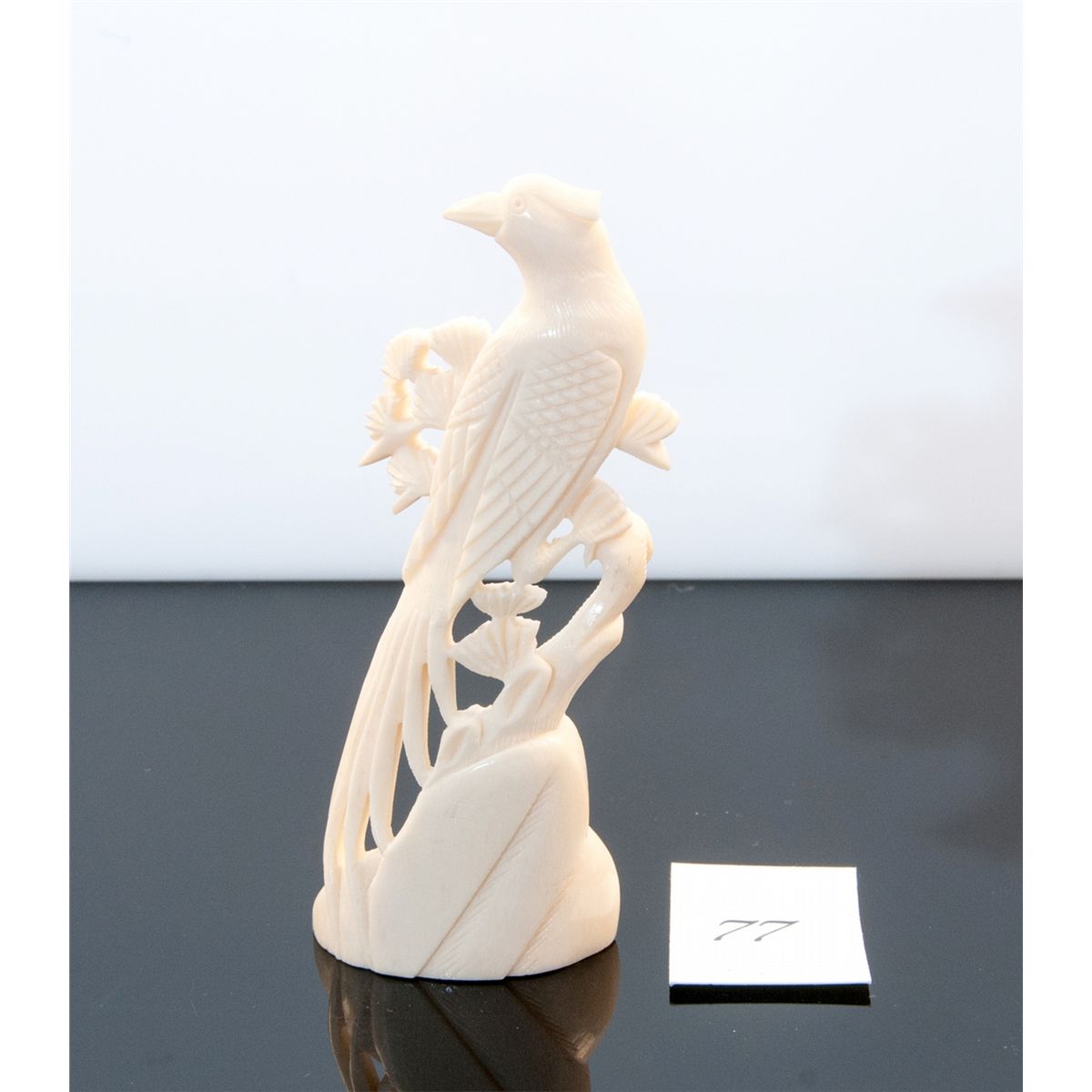 Genuine carved ivory bird figurine