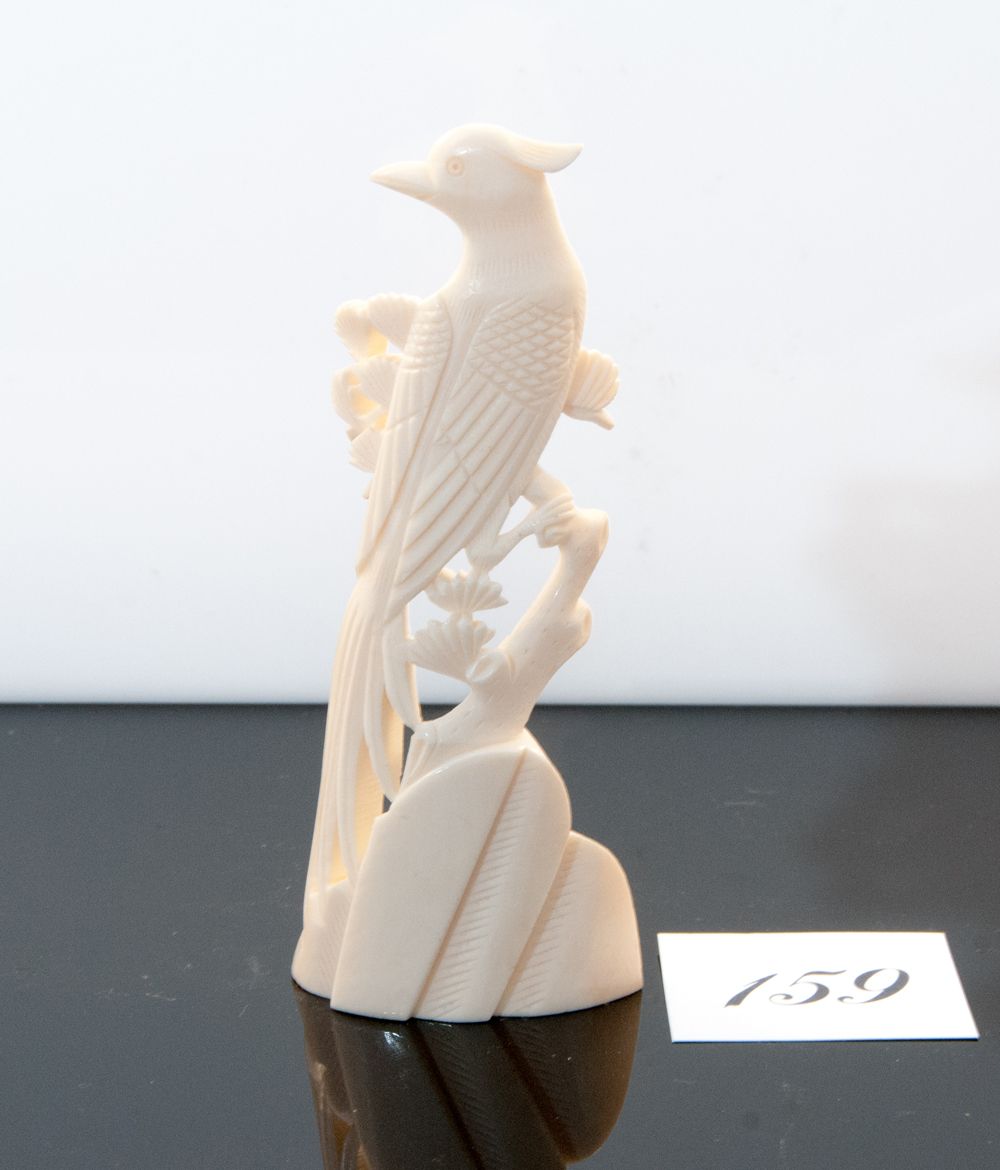 Genuine carved ivory bird figurine