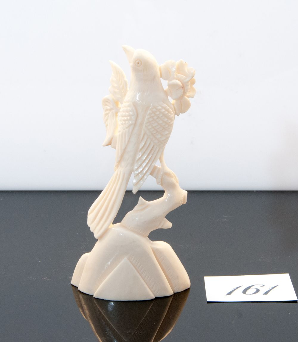 Genuine carved ivory bird figurine