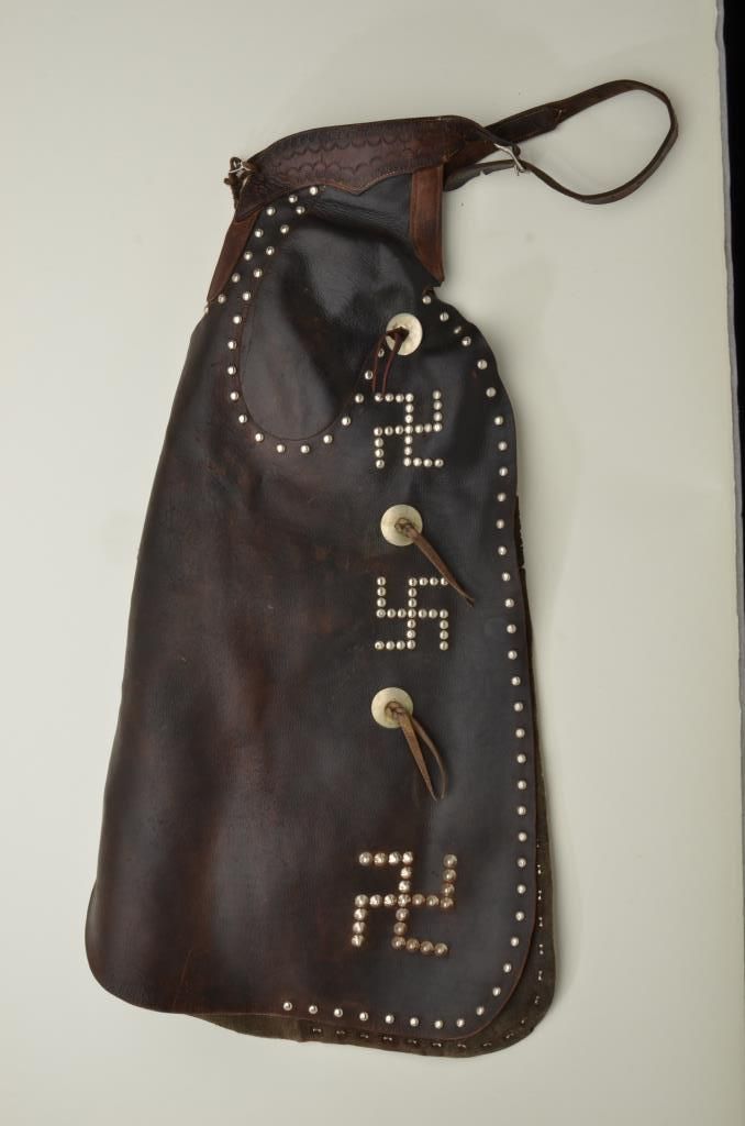 Pair of bat wing chaps with fancy studded decoration showing sun signs ...