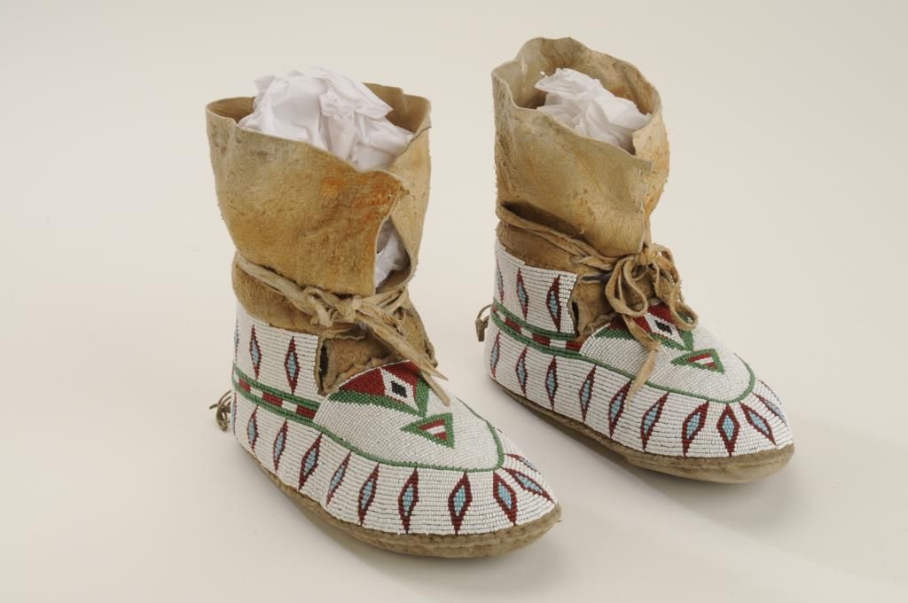 Pair of Cree high cuff moccasins with ornate and full beadwork showing ...