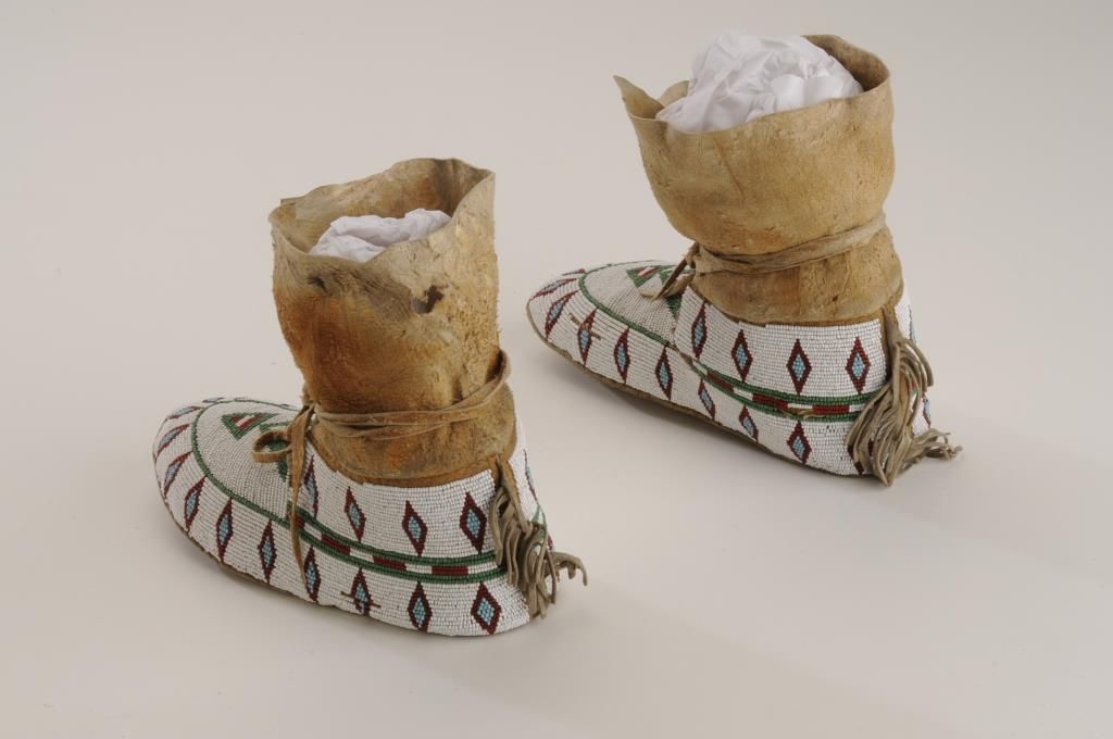 Pair of Cree high cuff moccasins with ornate and full beadwork showing ...