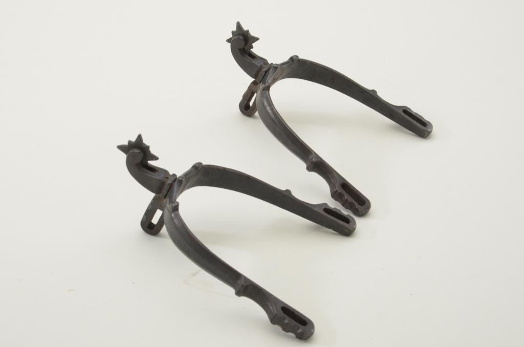 Turn-of-the-century American West spurs in ancient Roman style showing ...