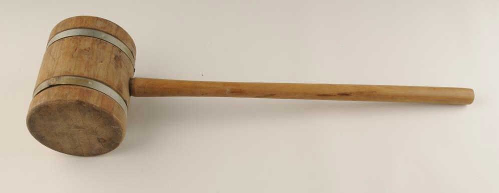 Massive old wood mallet, approx. 7” in diameter and 9” long with an ...