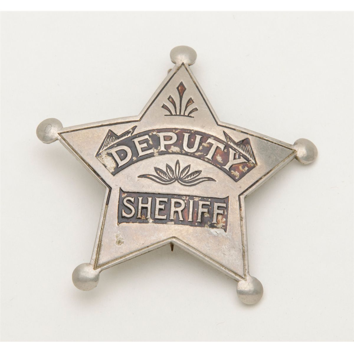 Five pointed star badge marked “DEPUTY SHERIFF” with makers mark on ...