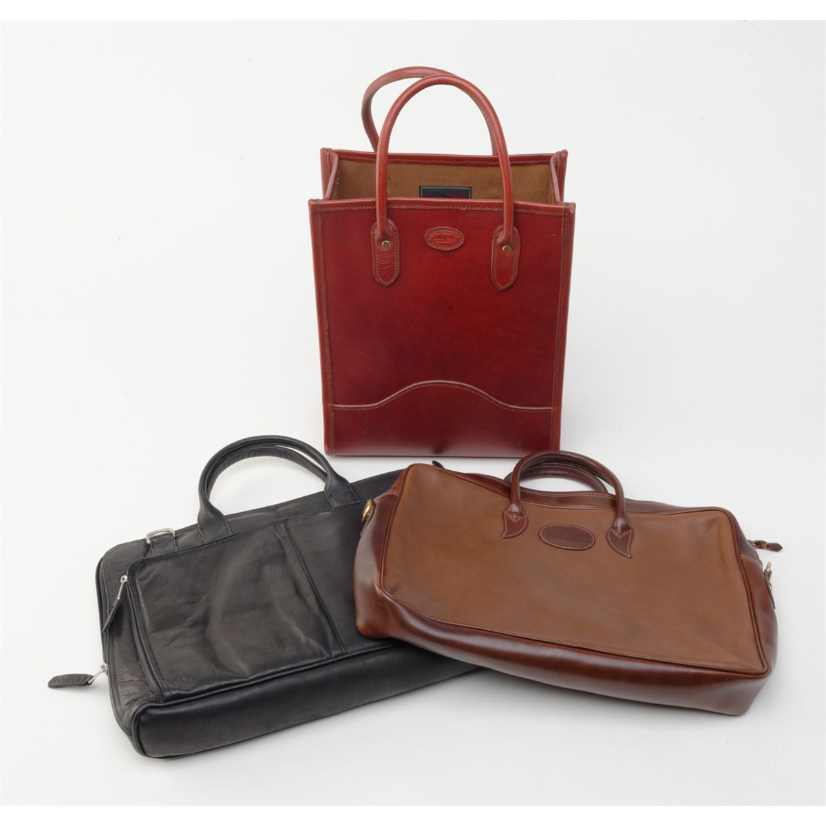 Lot of 2 leather briefs including a King Ranch and a leather Lewis ...