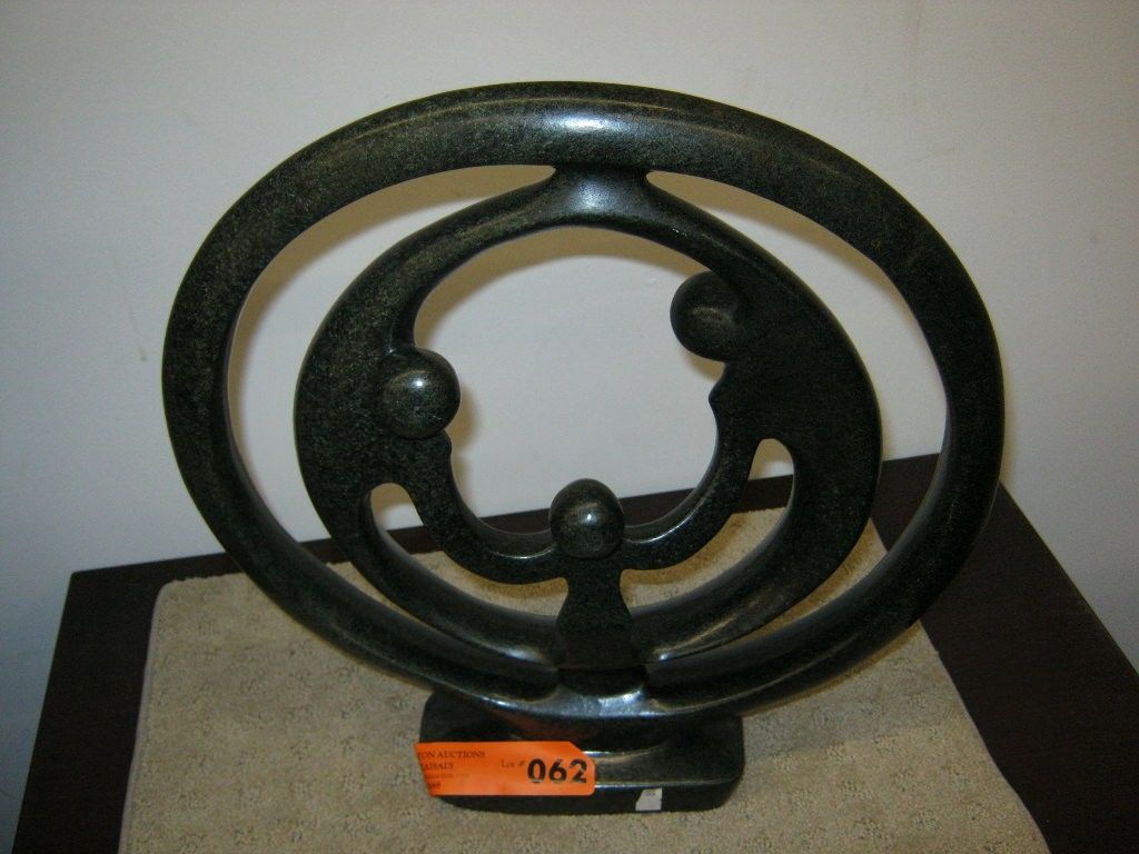 Carved family circle statue 15" tall 14" wide