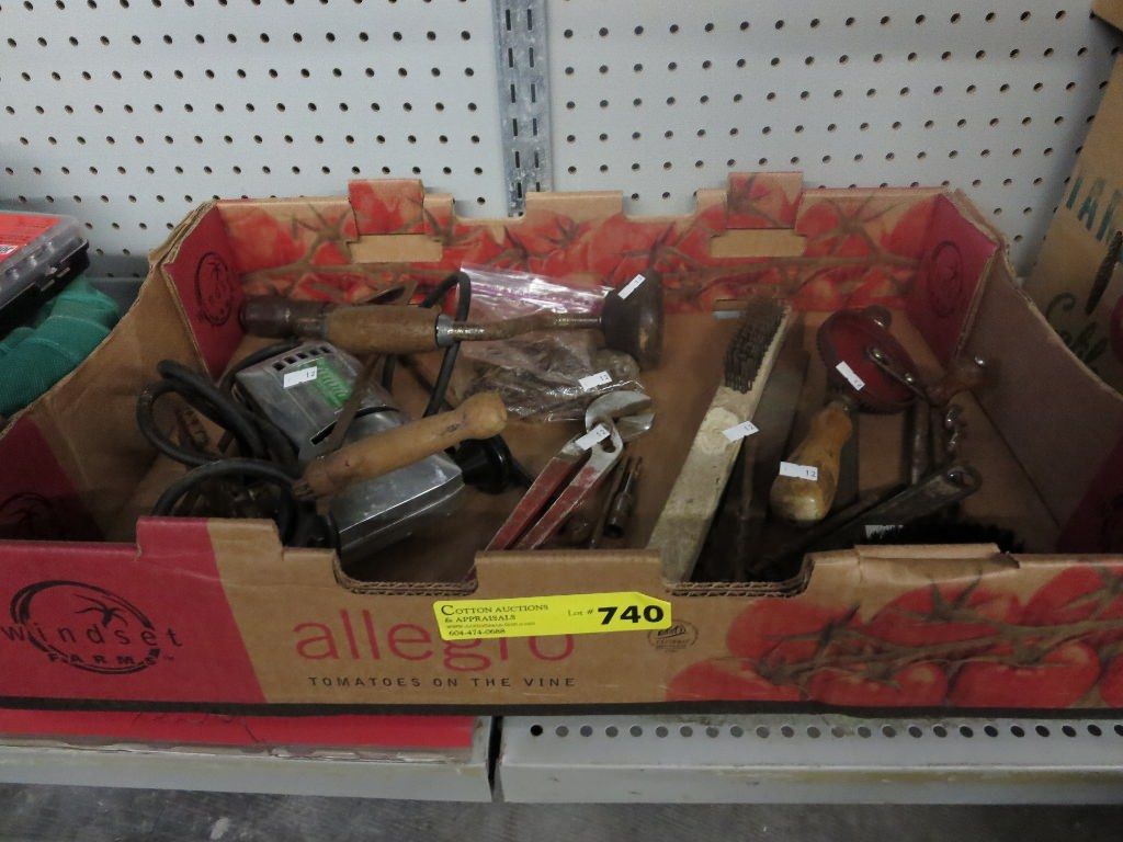 Cardboard box containing vintage tools