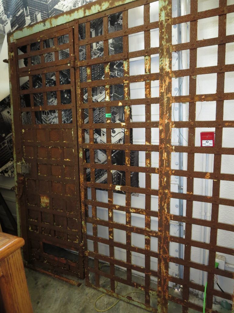 1910 prison wall with cell door