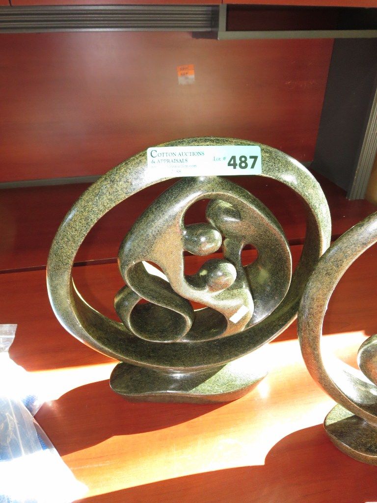 Carved soapstone family circle statue