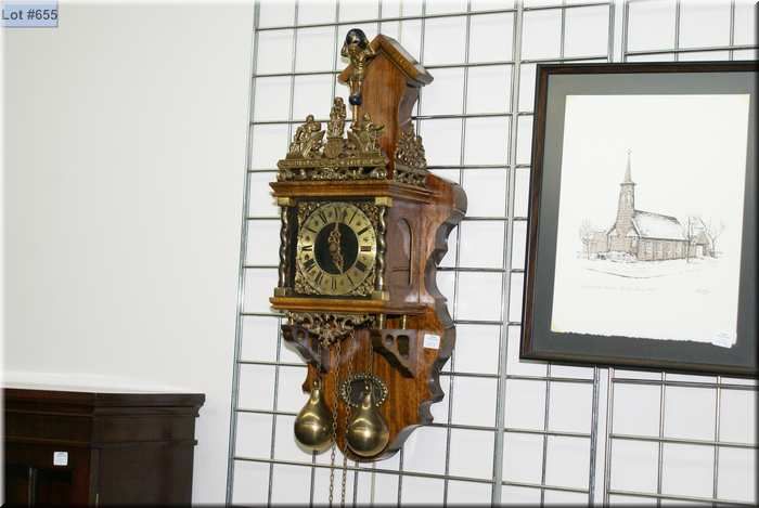Dutch wall clock with figural cast decoration and internal pendulum