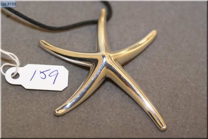 A sterling silver Tiffany & Co. Elsa Peretti starfish pendant with ...