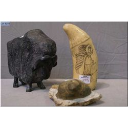 Soapstone carving of a seal plus a cast musk ox and a cast scrimshaw ...