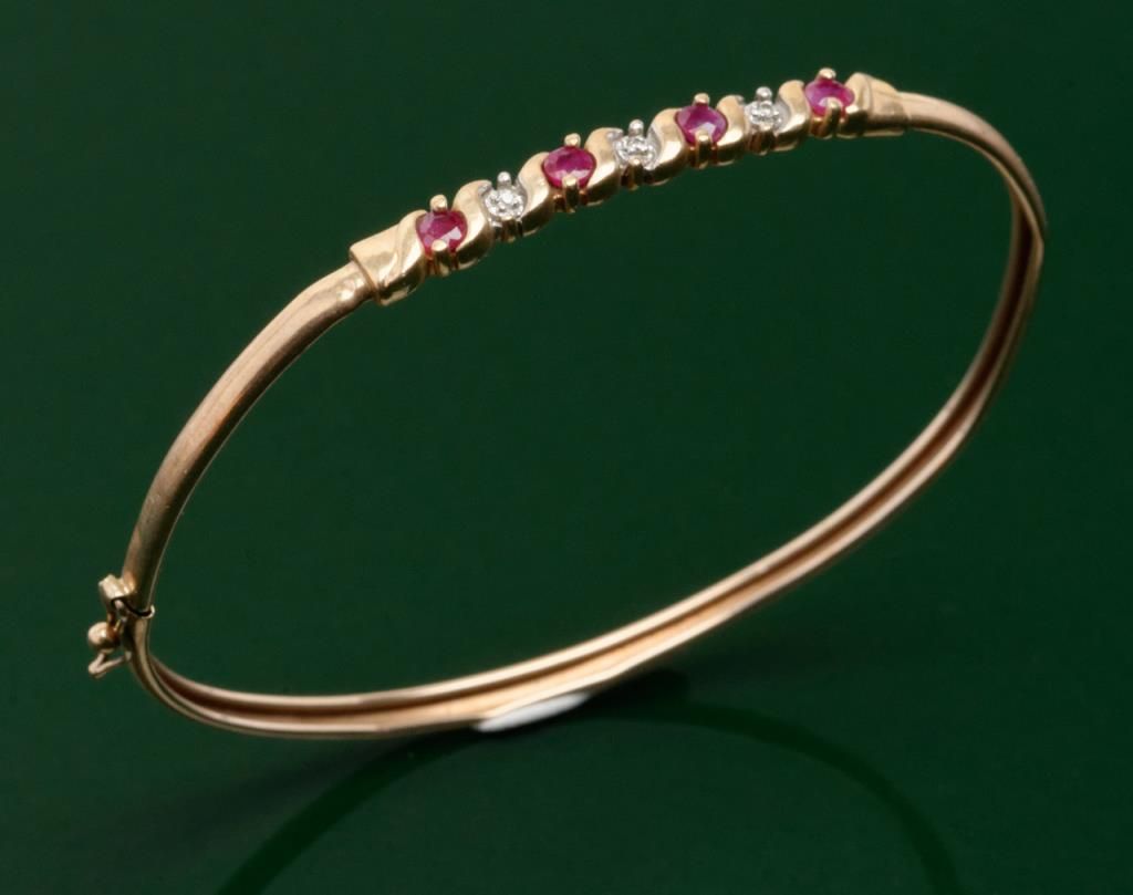 10k gold bangle bracelet with 4 rubies and 3 diamond accents. Est ...