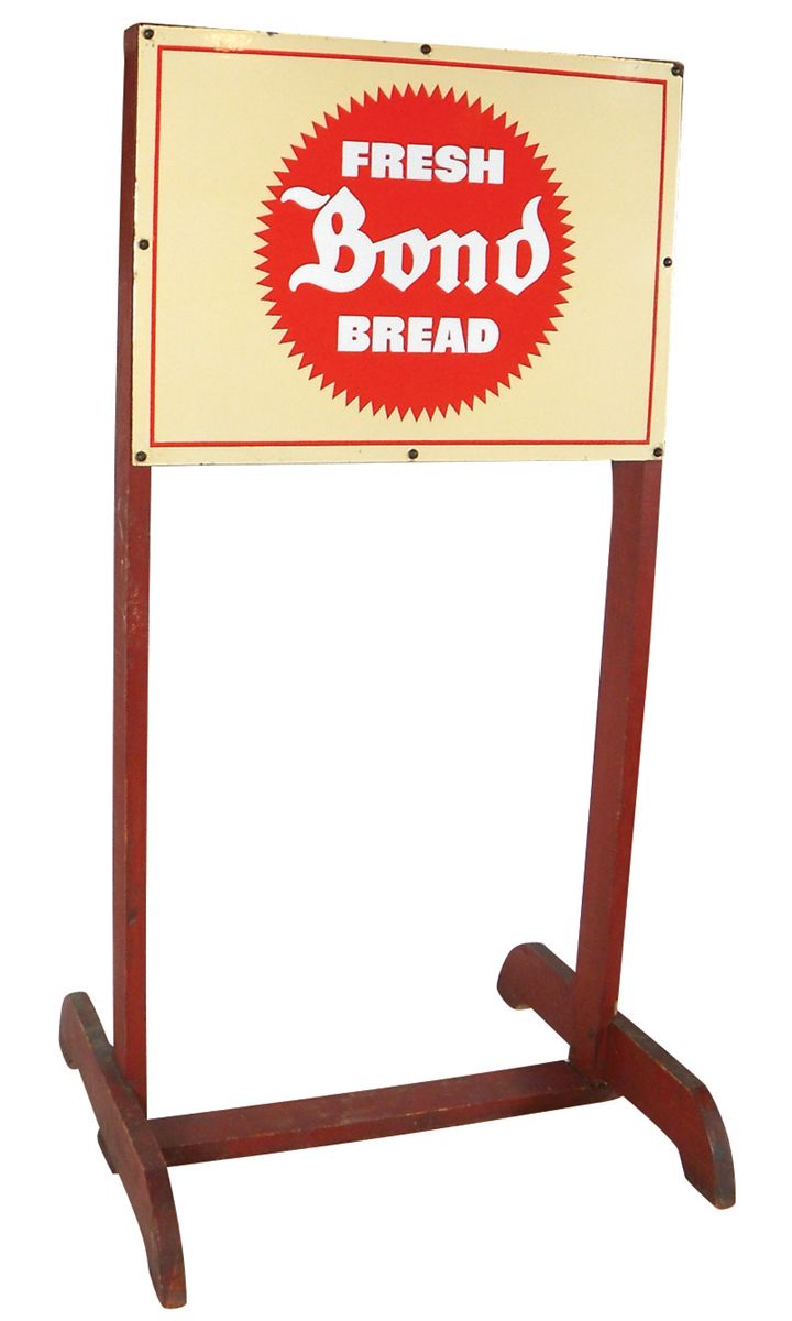 Country store broom rack, "Fresh Bond Bread" porcelain signs on both ...