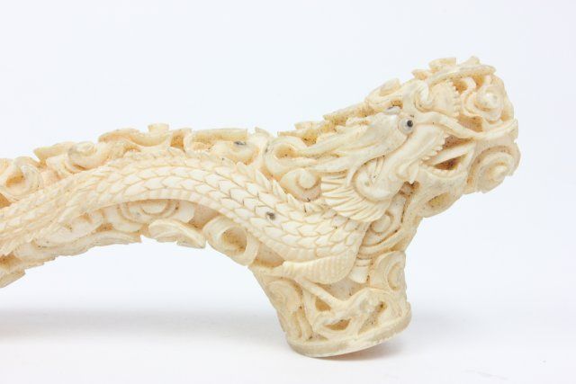 Carved bone Chinese cane top with dragons
