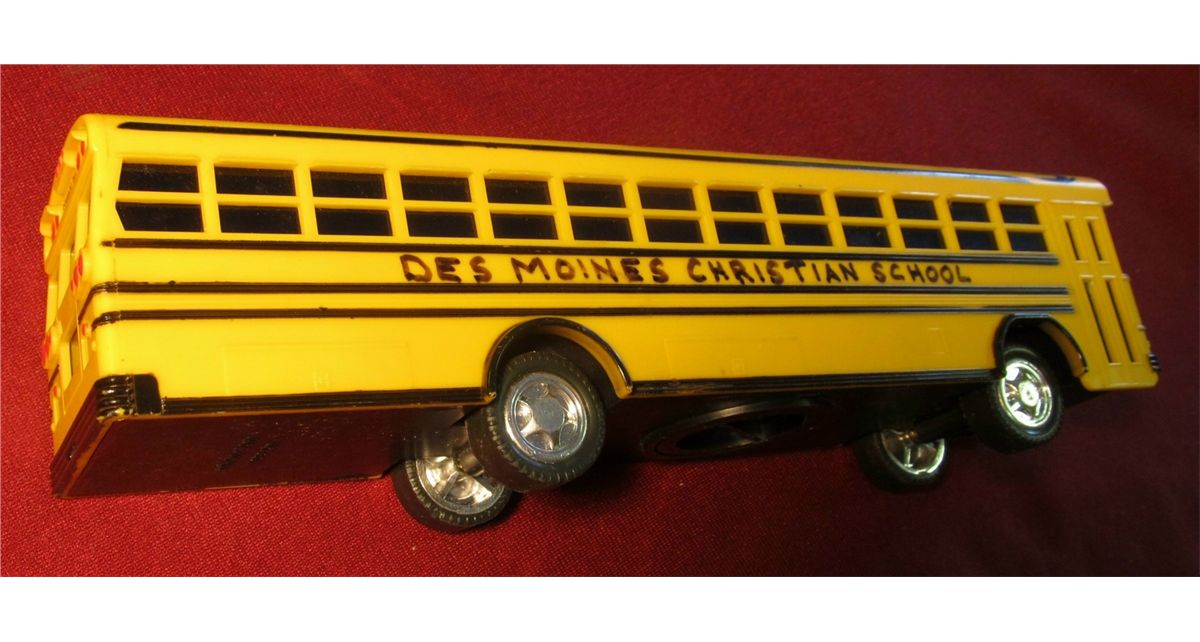 1308. Blue Bird School Bus Bank with hand written lettering "Des Moines ...