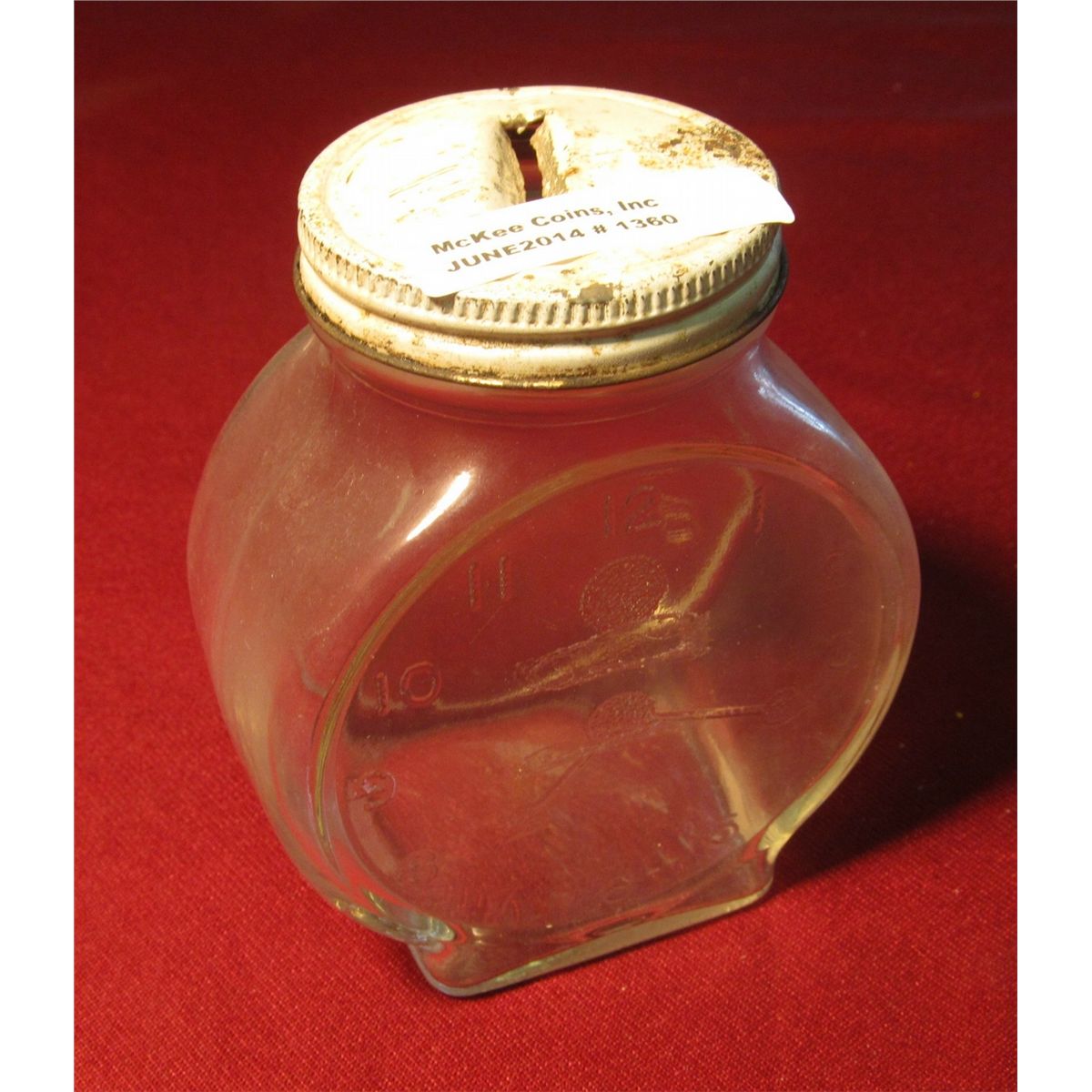 1360. Glass Jar Clock Bank. Clear glass. Design Patent No. 95888.