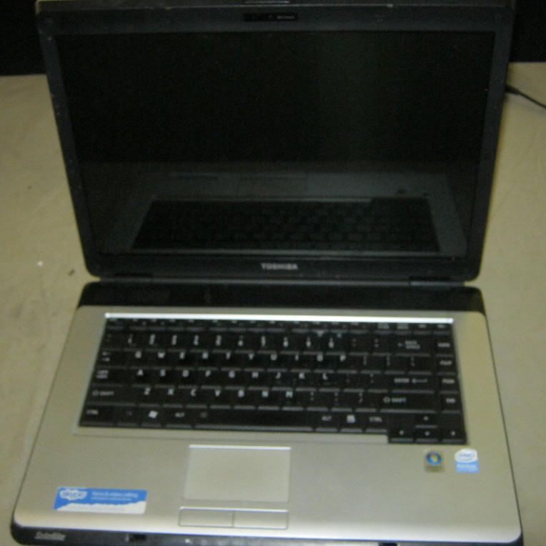 Silver Toshiba Laptop Computer. Police Seized