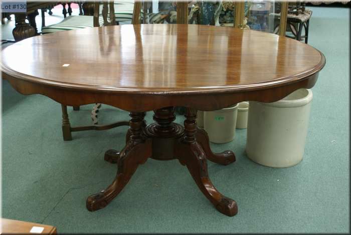 A Victorian center pedestal parlour table with carved supports and ...