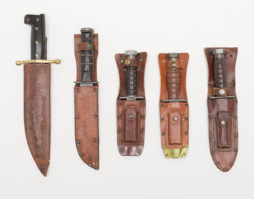lot of 5 misc. knives with sheaths, mostly U.S. military. Est.: $300-$600.