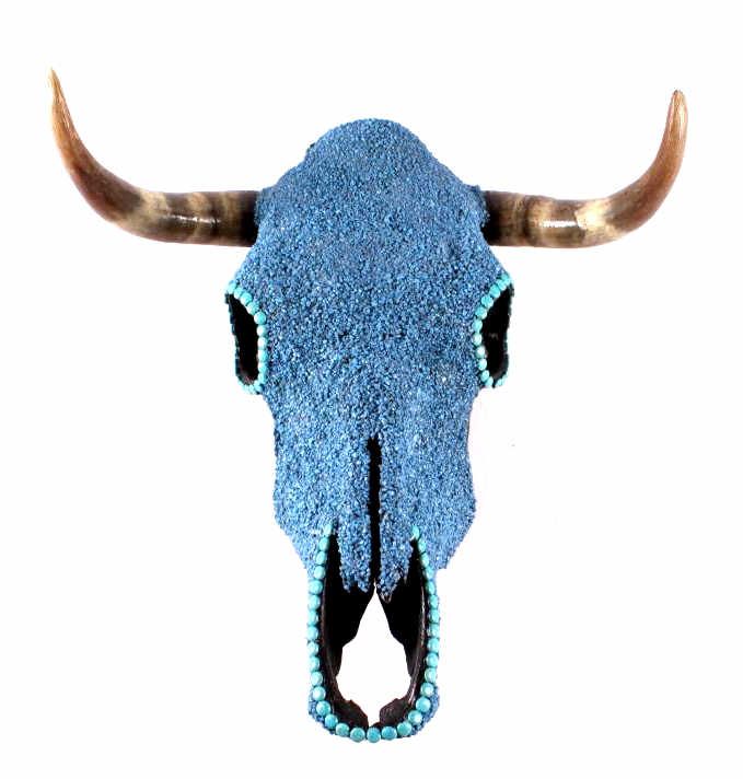 Turquoise Covered Steer Cow Skull The lot shows a