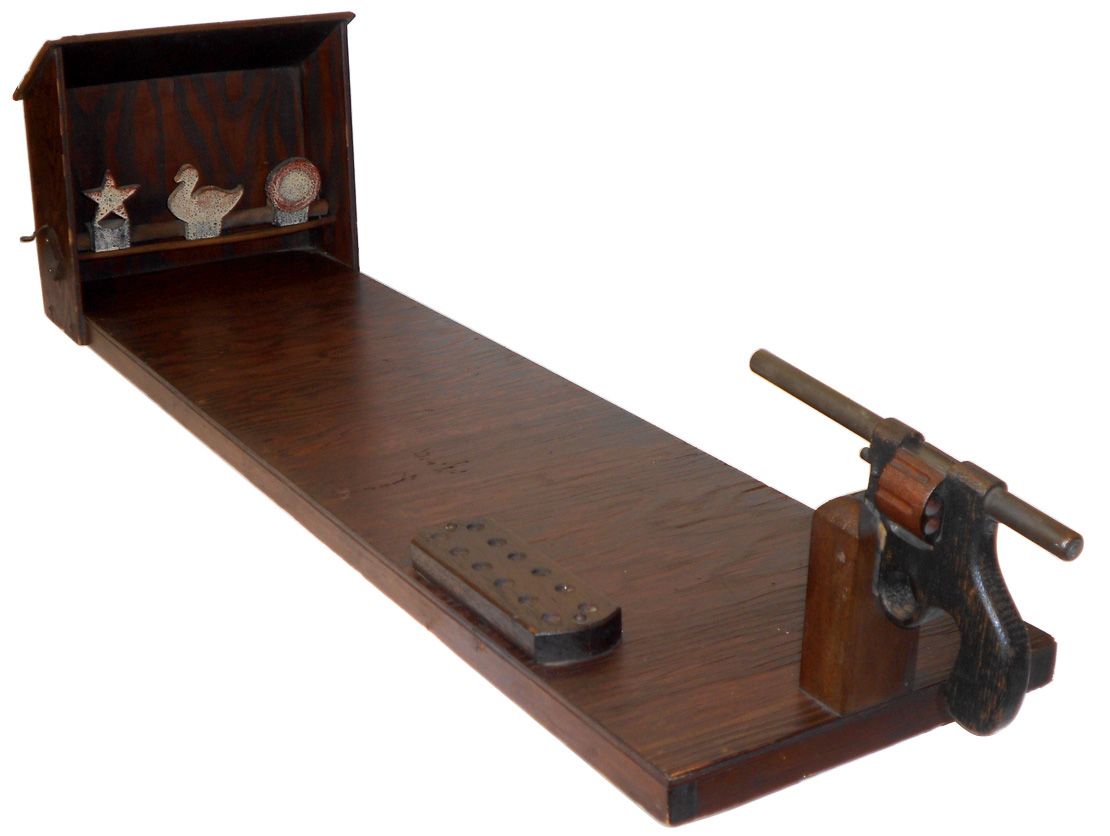 Folk art target shoot, a hand-made all wood game w/carved gun, bulls ...